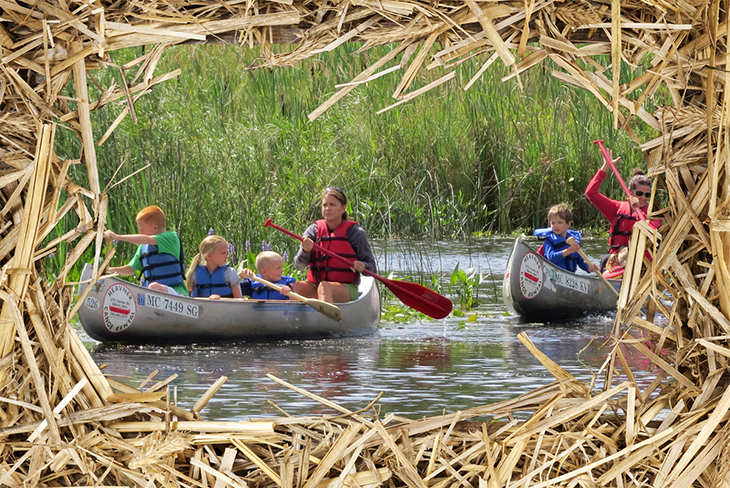 Straw frame on rustic wood – Heavner Canoe & Kayak Rental